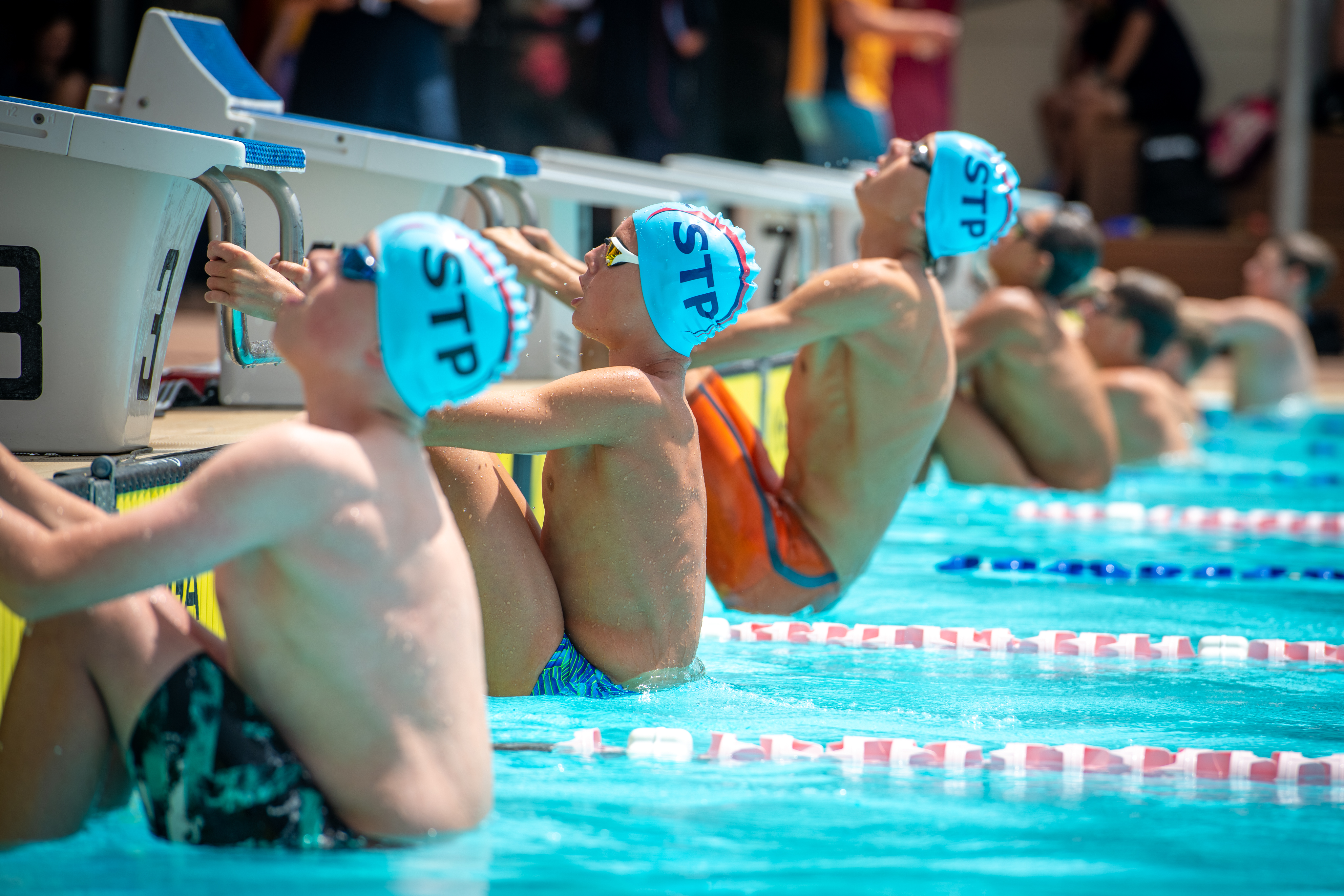 Competitive Swimming from Learn to Swim to Winning Races