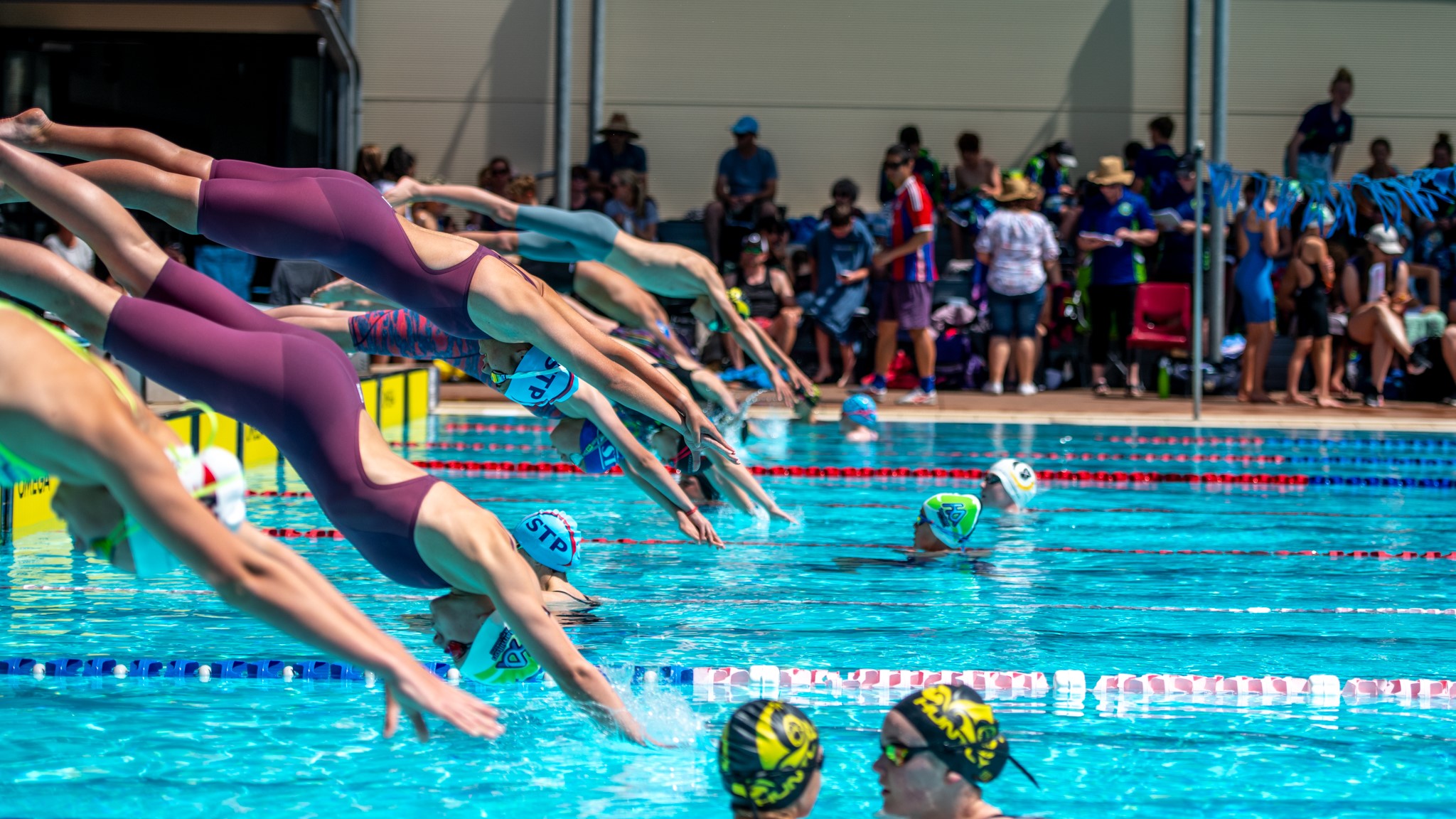 Competitive Swimming from Learn to Swim to Winning Races